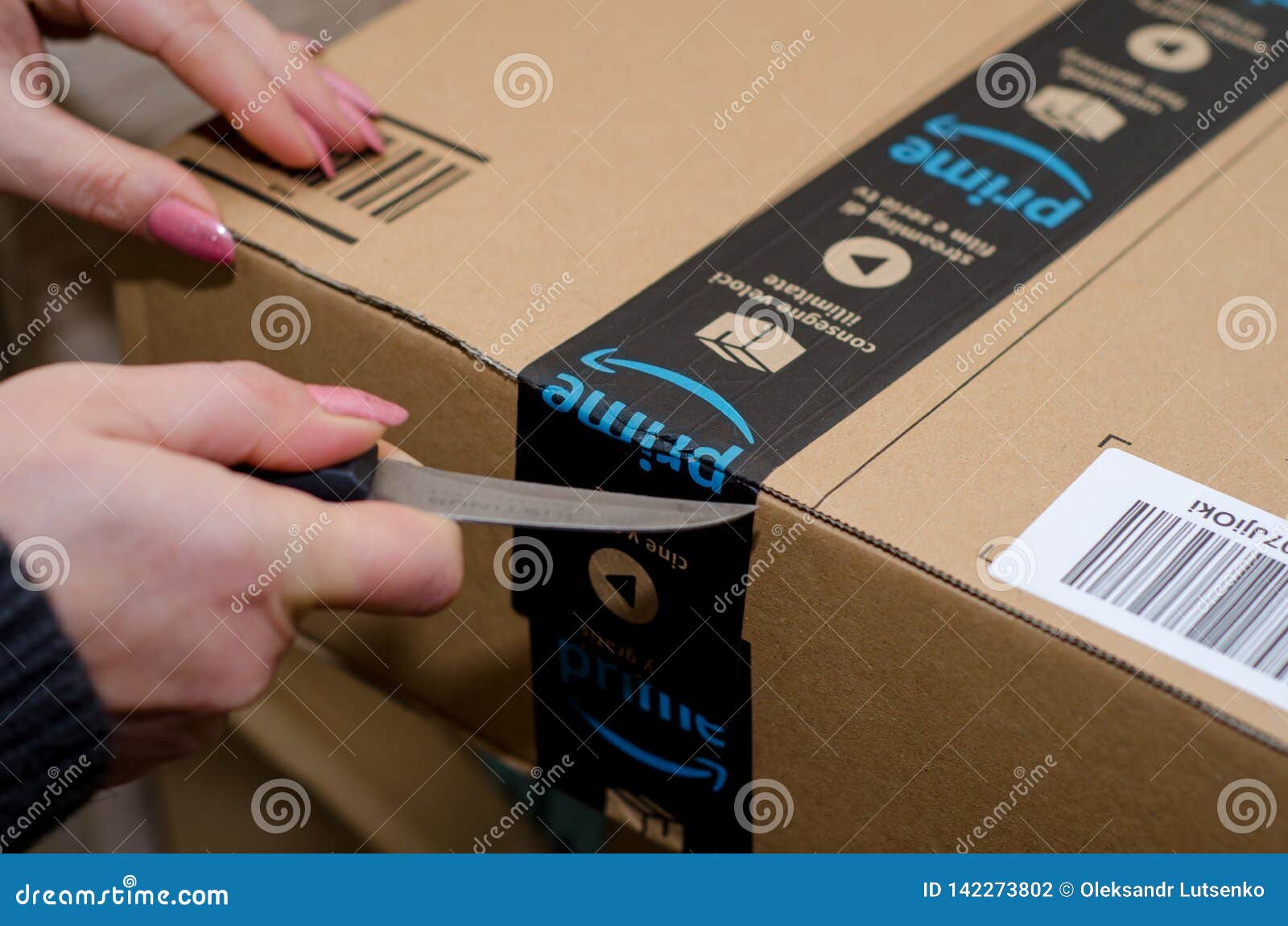 Soest, Germany - December 12, 2018: Woman Opening Amazon Prime Package ...