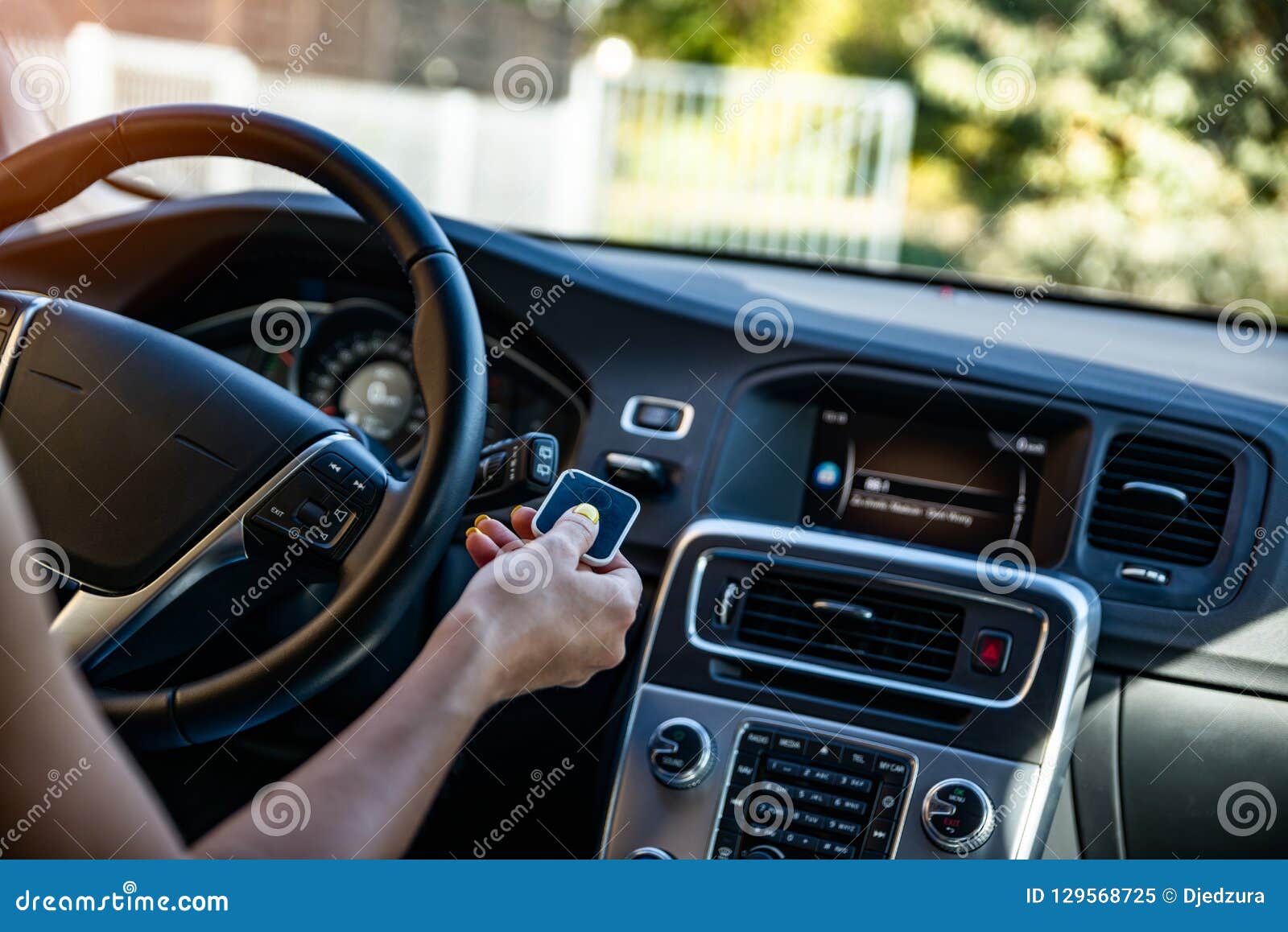 Woman Opening Automatic Property Gate with Remote Control Stock Image ...