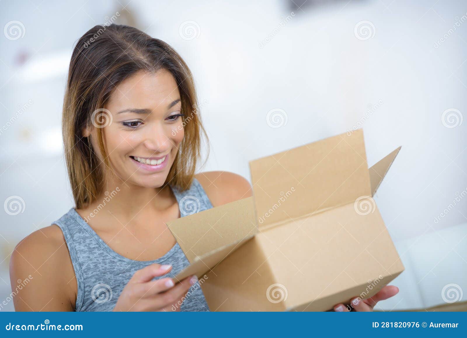 Woman opening box stock photo. Image of brics, opening - 281820976