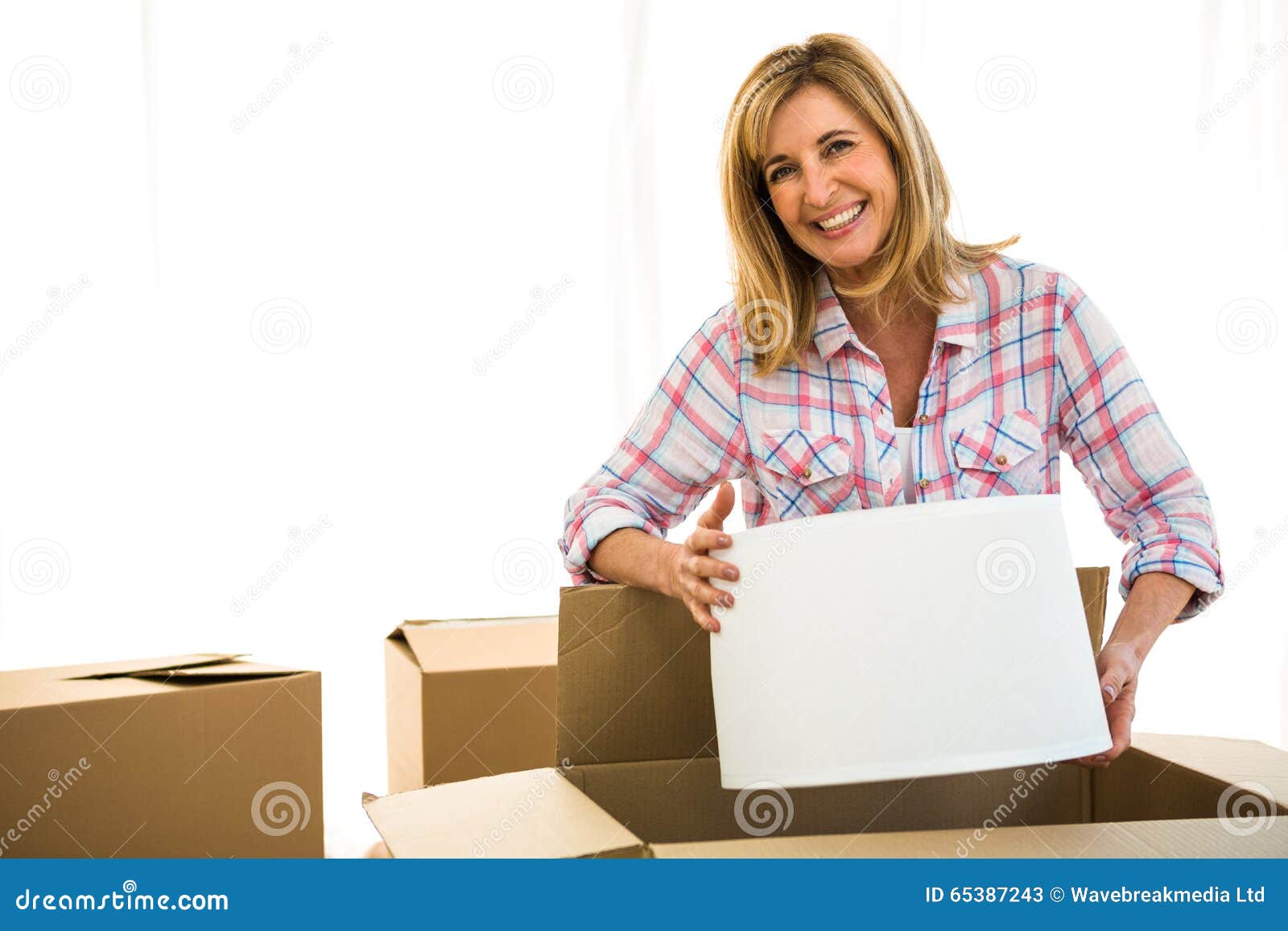 Woman opening a box stock image. Image of face, denim - 65387243