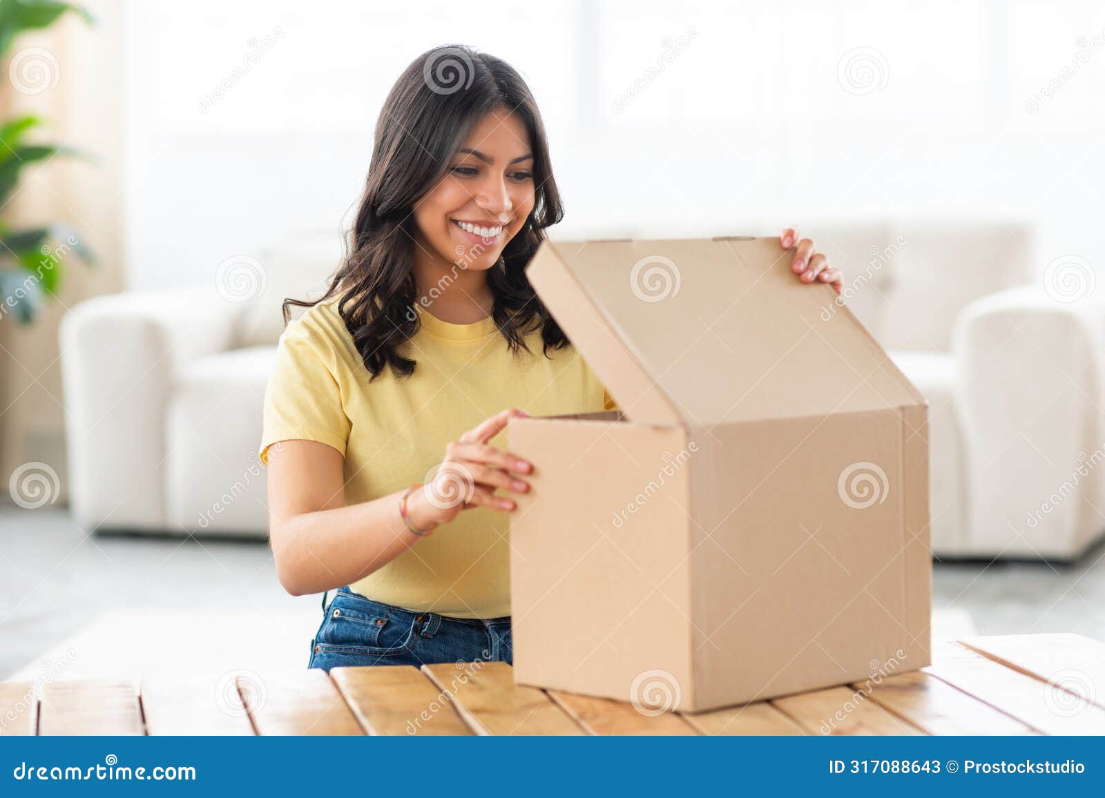 Woman Opening a Box on a Table Stock Image - Image of holiday, package ...