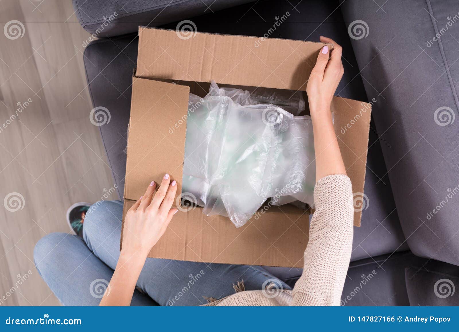 Woman Opening Delivered Parcel Stock Photo - Image of human, female ...