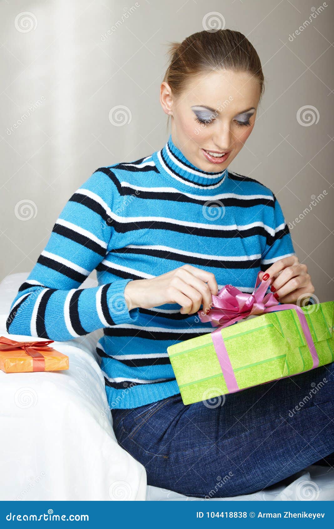 Woman opening gift box stock photo. Image of positive - 104418838