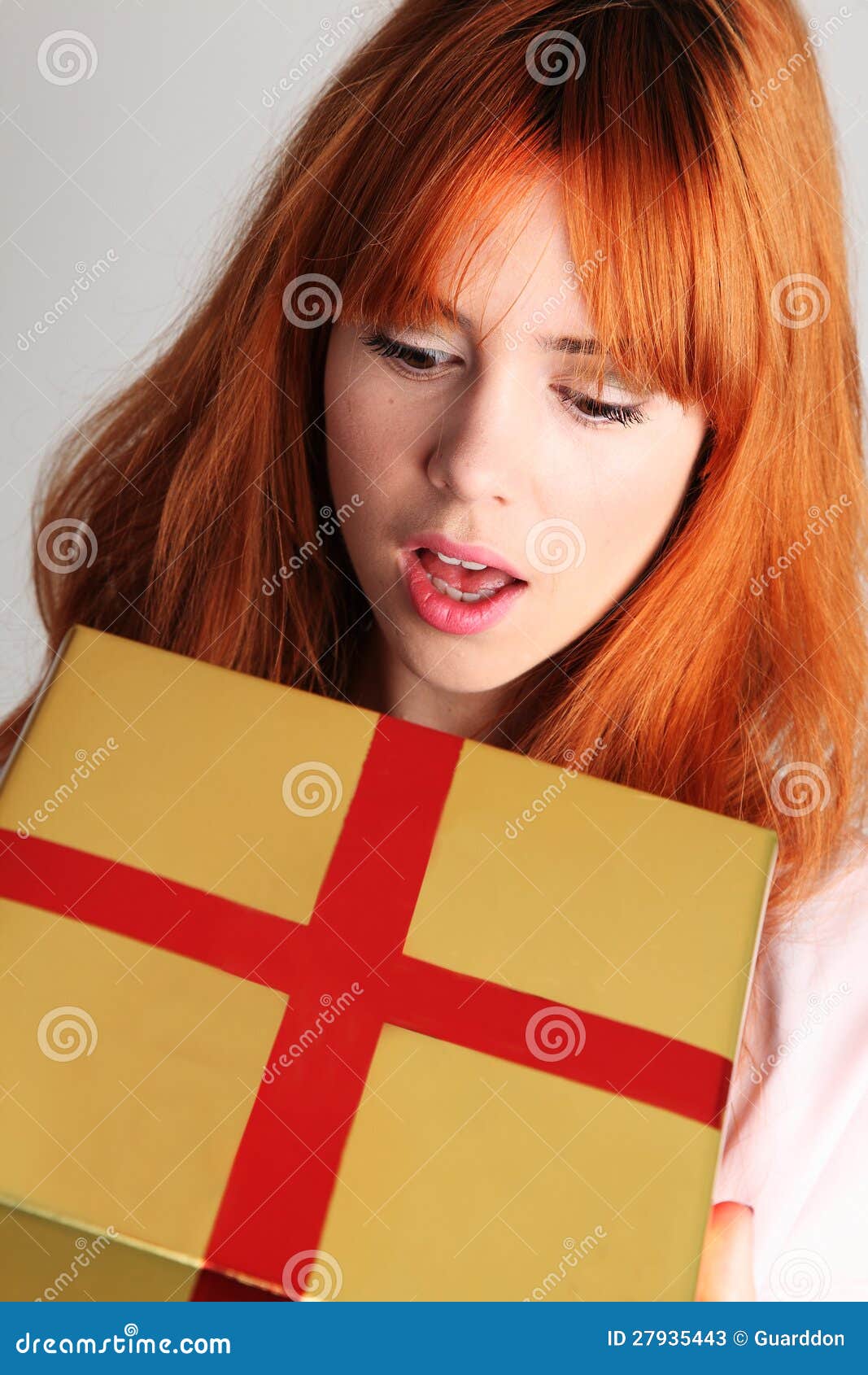 Woman opening a present stock image. Image of happiness - 27935443