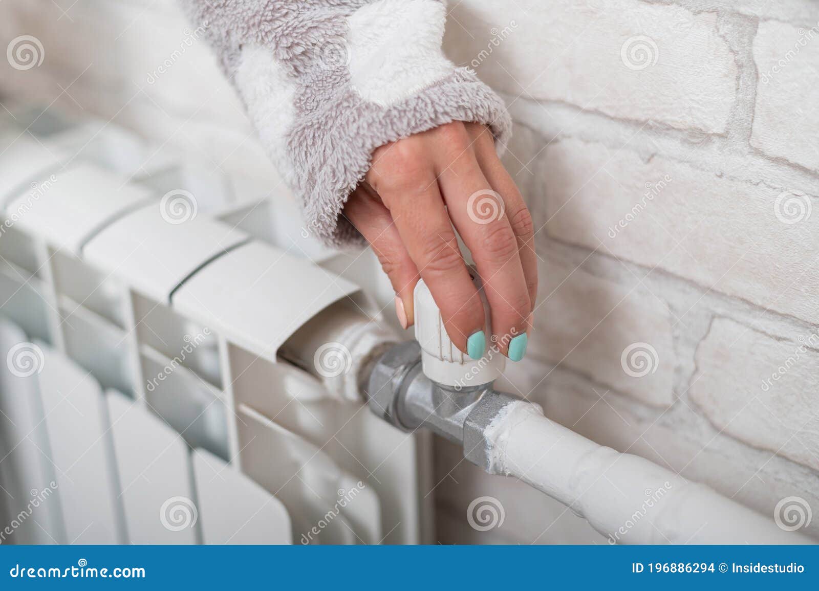 The Woman Opens the Valve of the Radiator Heating. Stock Photo - Image ...