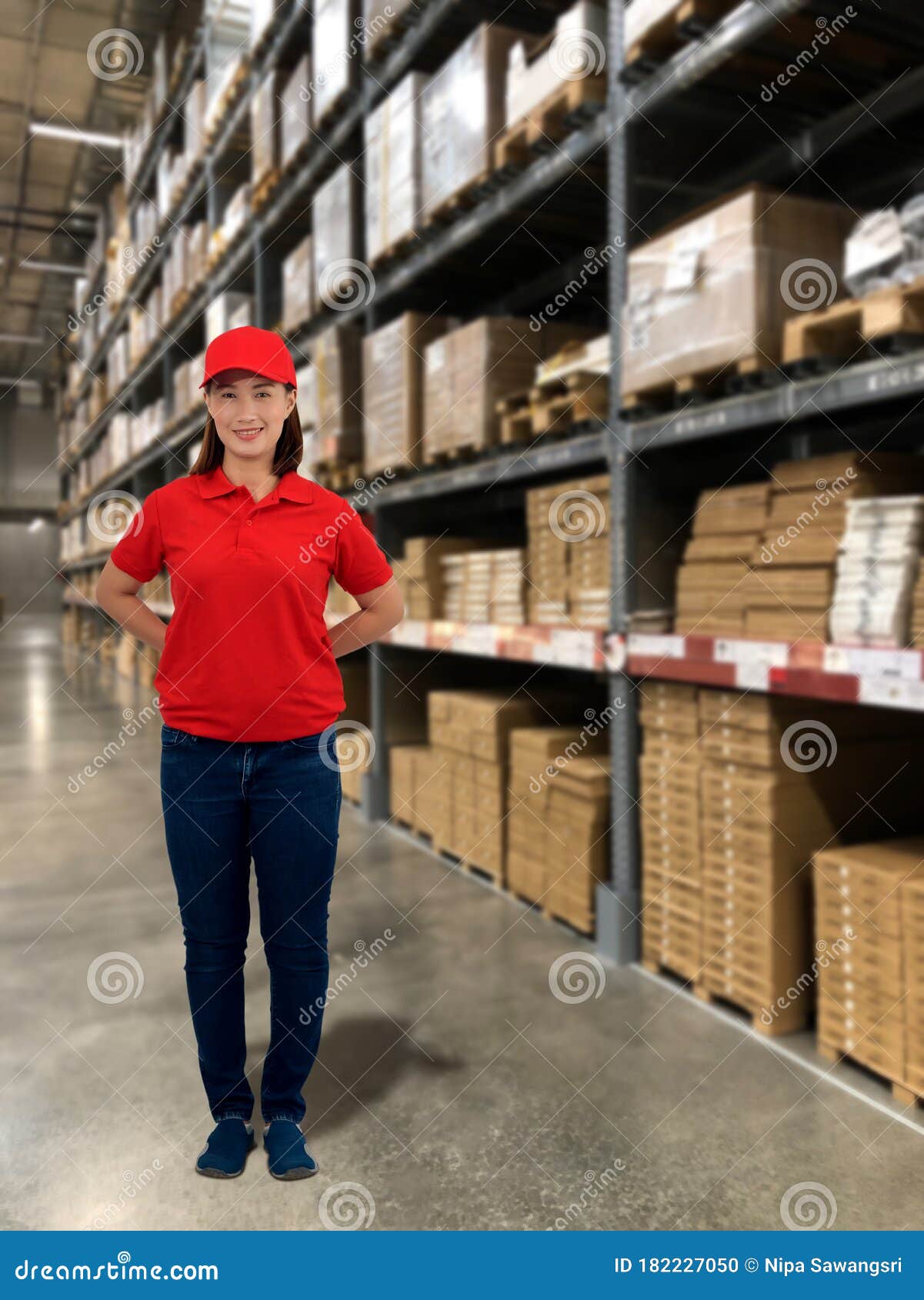 Woman Operator in Uniform with Blurred the Background of the Warehouse ...