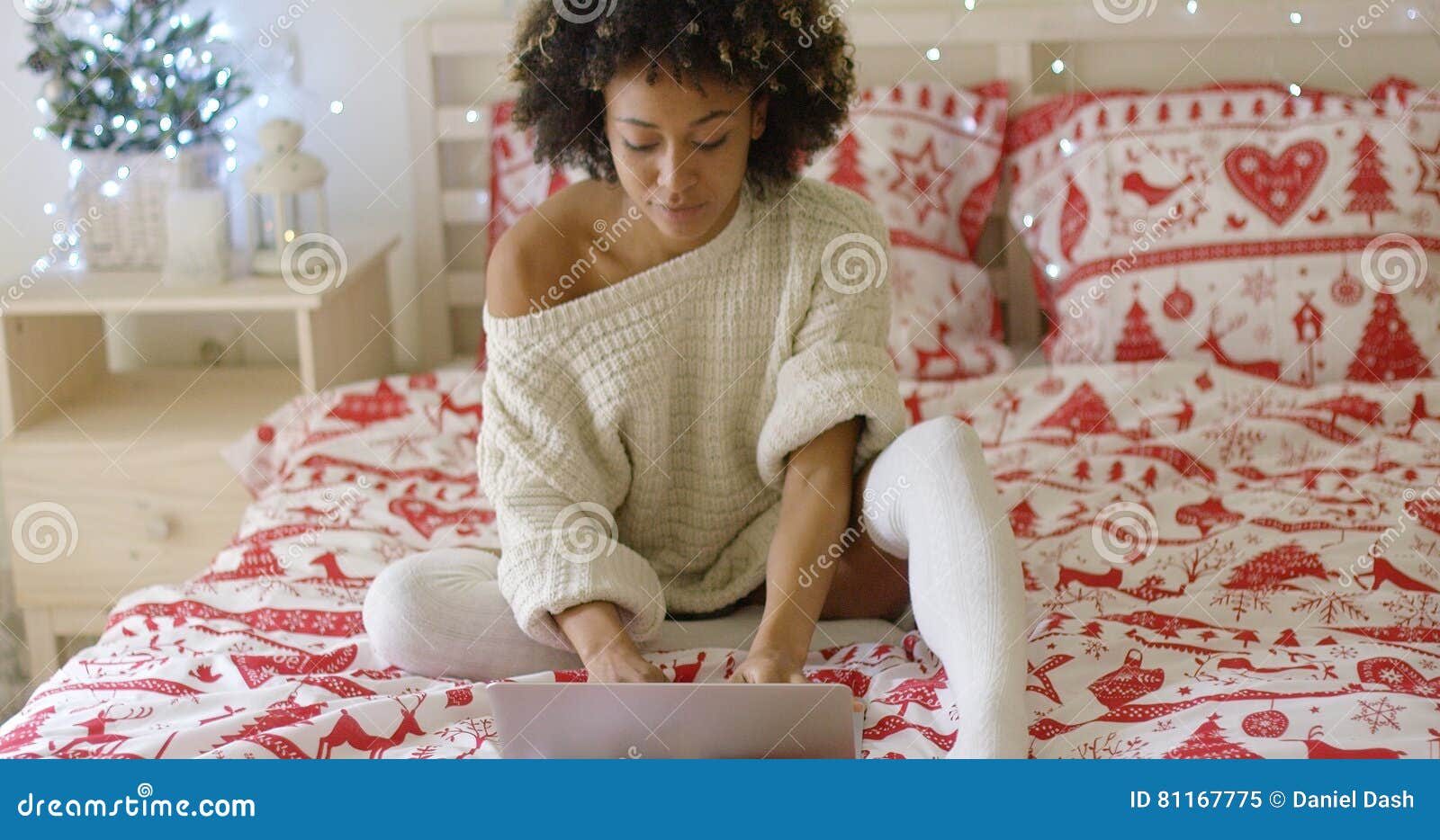 Woman in Oversized Sweater on Bed Using Laptop Stock Image - Image of ...