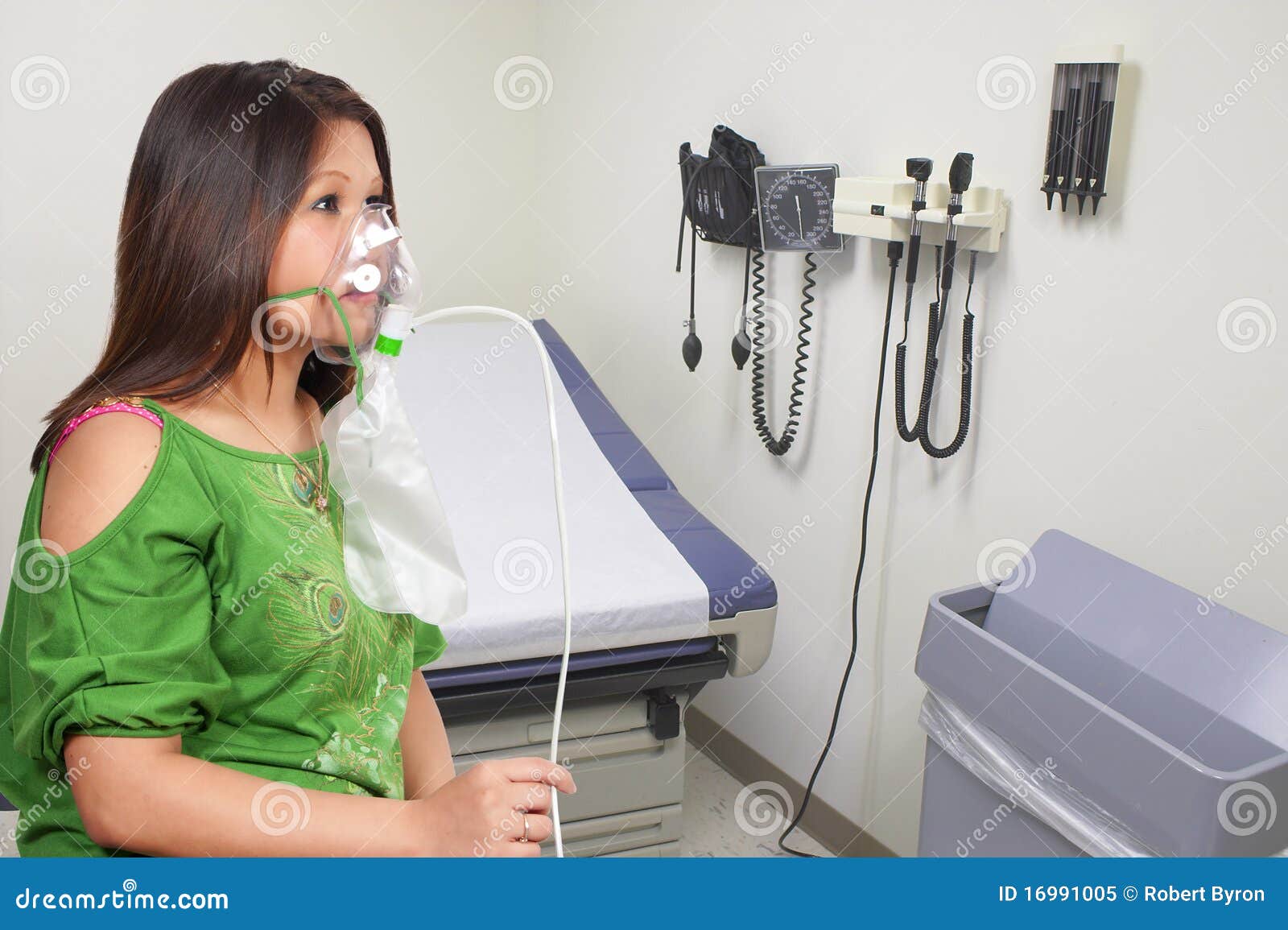 Woman With An Oxygen Mask And In Wheelchair Is Reading Book With Little ...