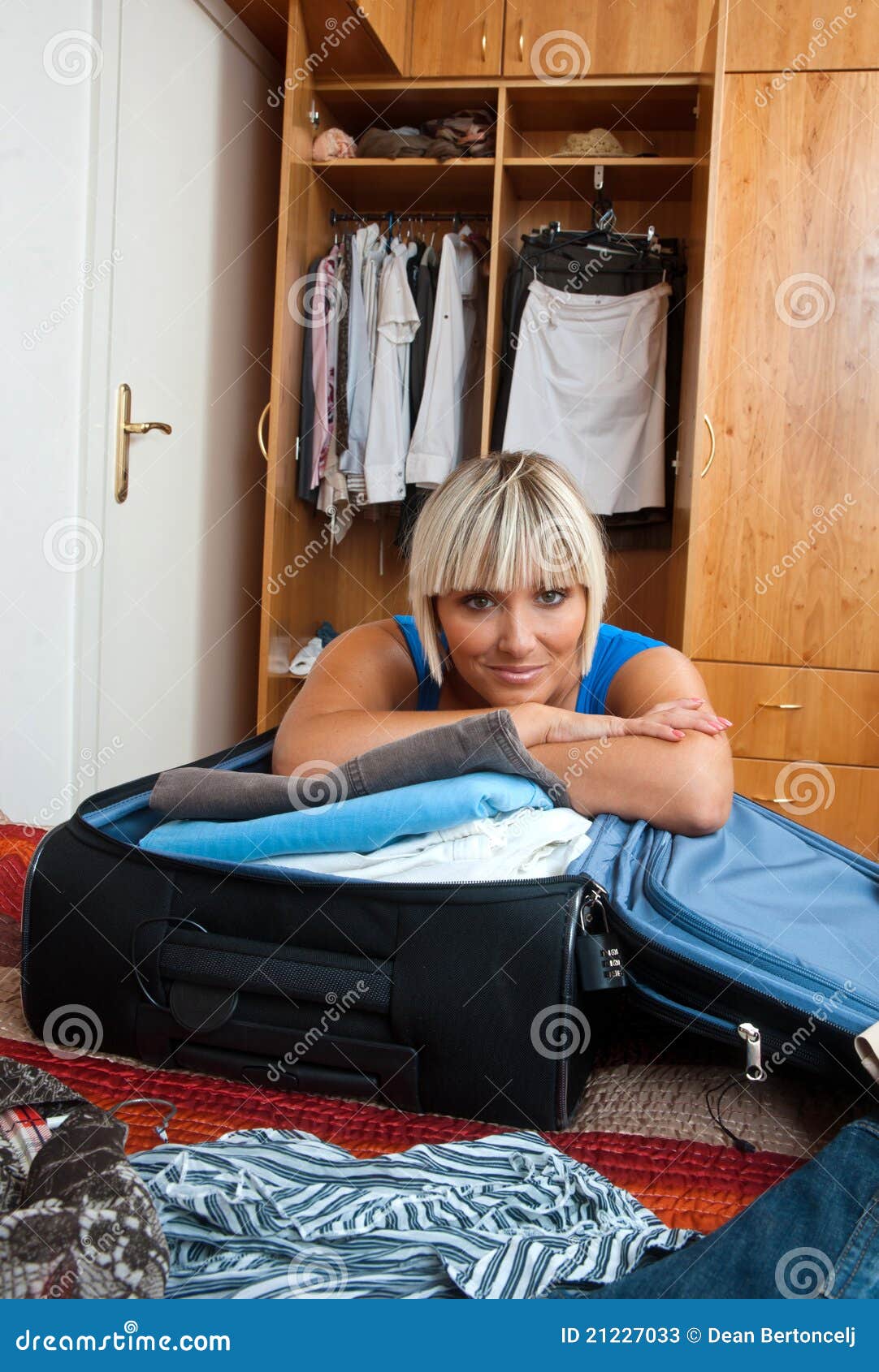 Woman packing clothes stock image. Image of person, clothing - 21227033