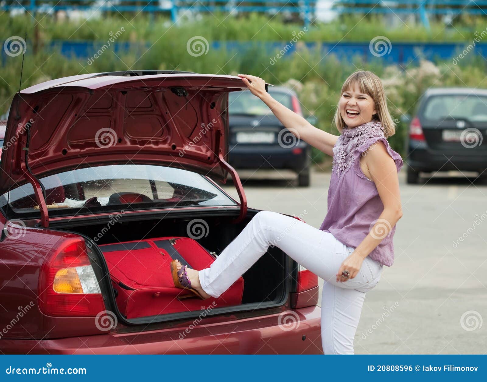 Woman Packing Her Baggage into the Car Stock Photo - Image of outdoors ...