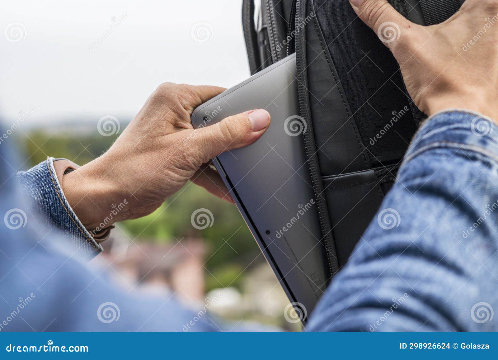 Woman Packing a Laptop in Backpack Stock Photo - Image of jacket ...