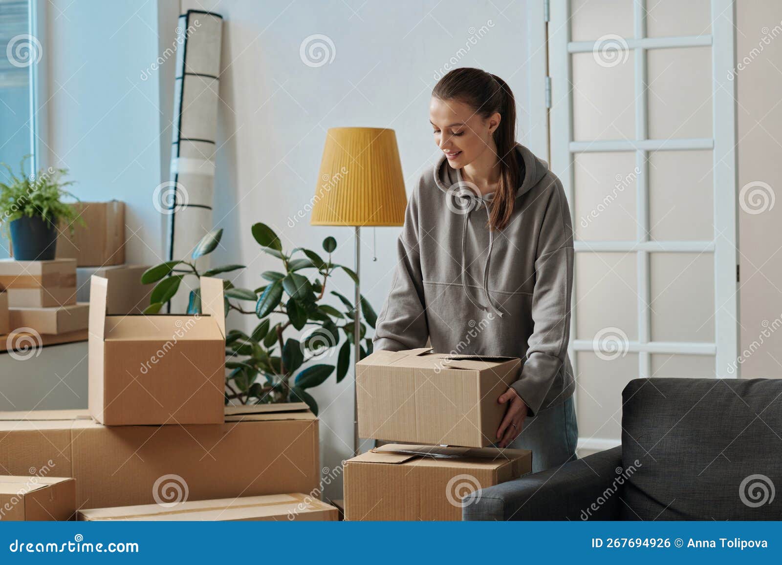 Woman Packing Things in Boxes Stock Photo - Image of carton, indoors ...