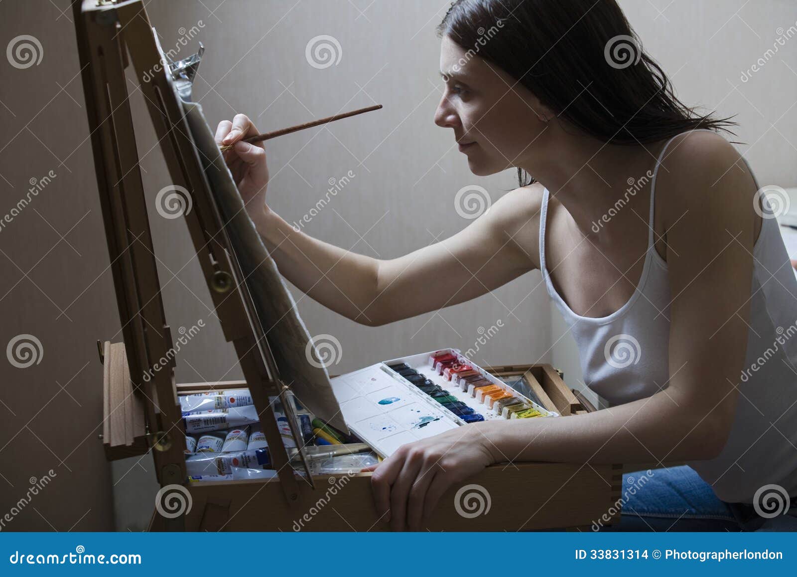 Woman Painting on Easel stock photo. Image of canvas - 33831314