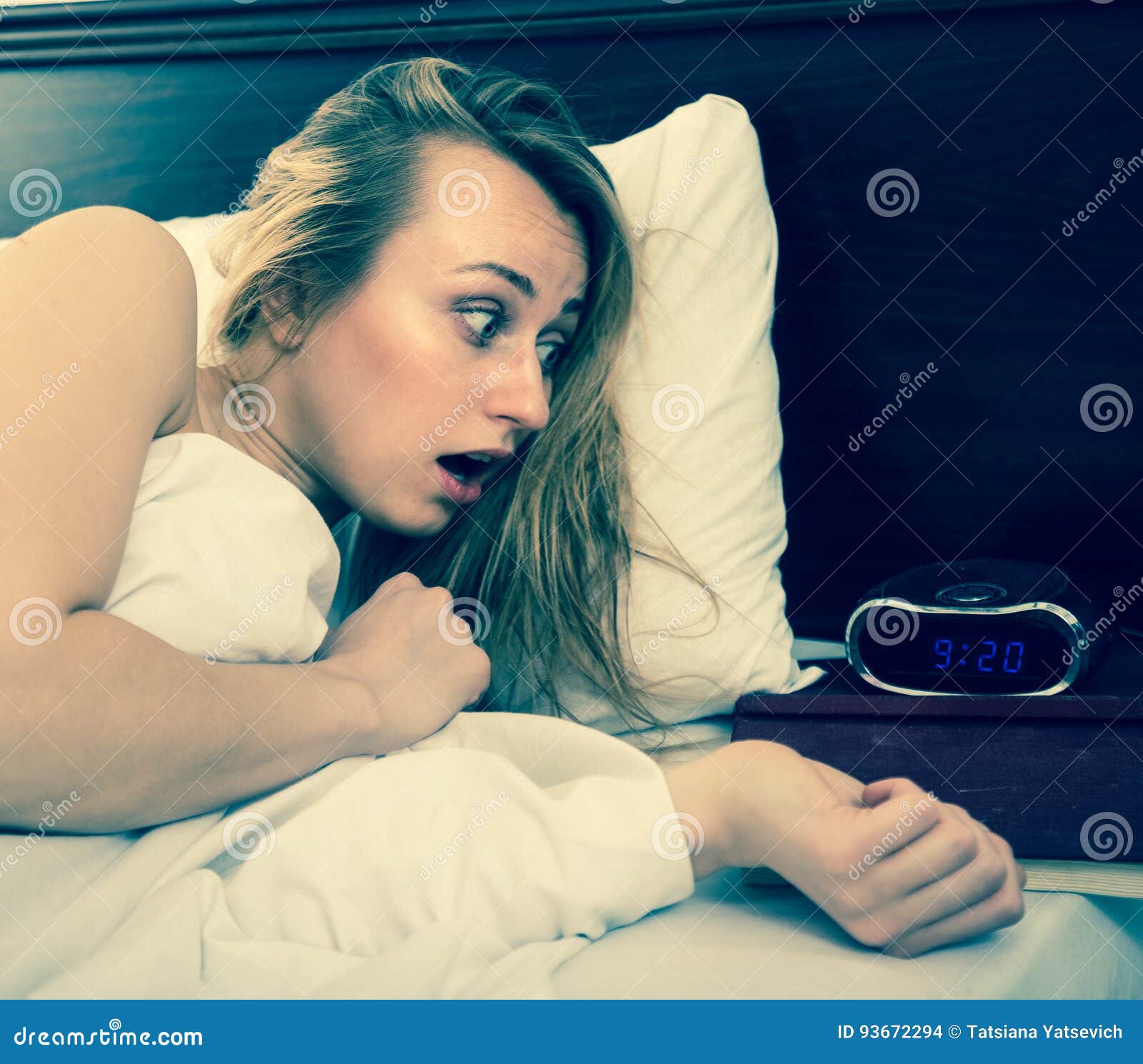 Woman in Panic Looks at Clock Stock Photo - Image of horror, lying ...