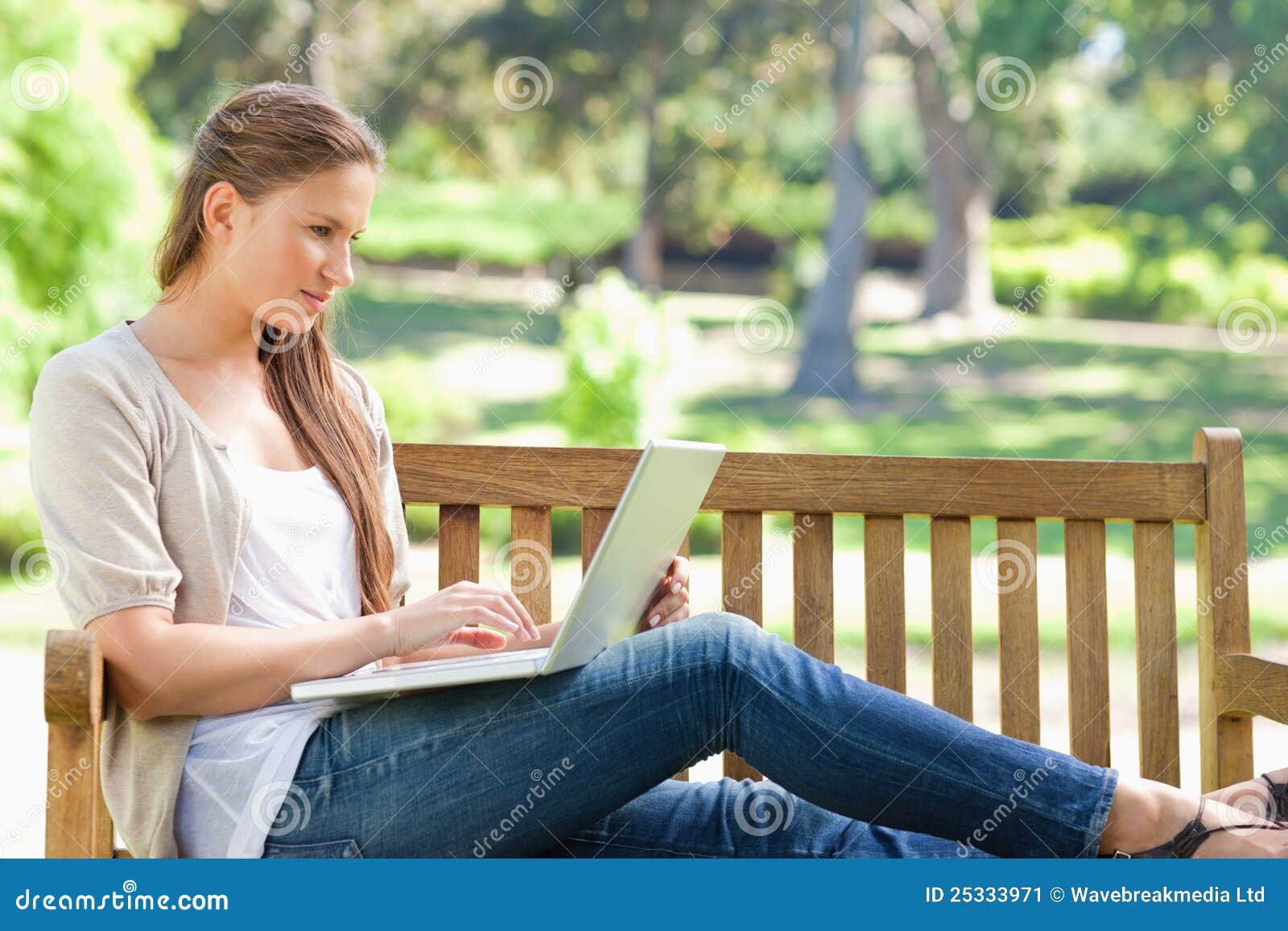 Woman on a Park Bench Working on Her Laptop Stock Image - Image of ...