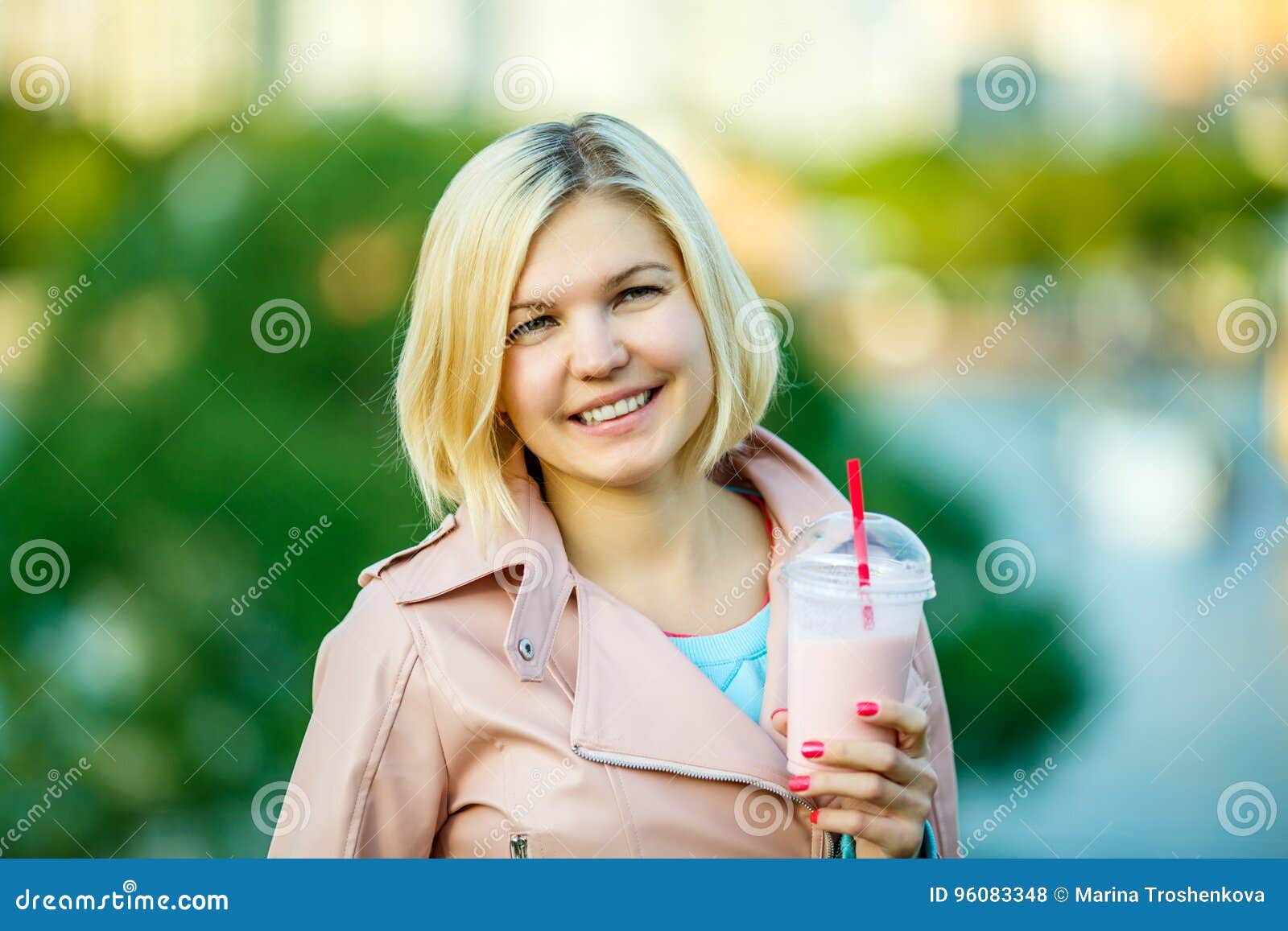 Woman in Park with Milkshake Stock Photo - Image of drink, people: 96083348
