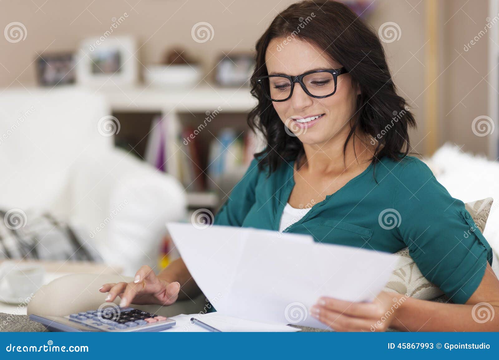 Woman paying bills stock image. Image of home, calculator - 45867993