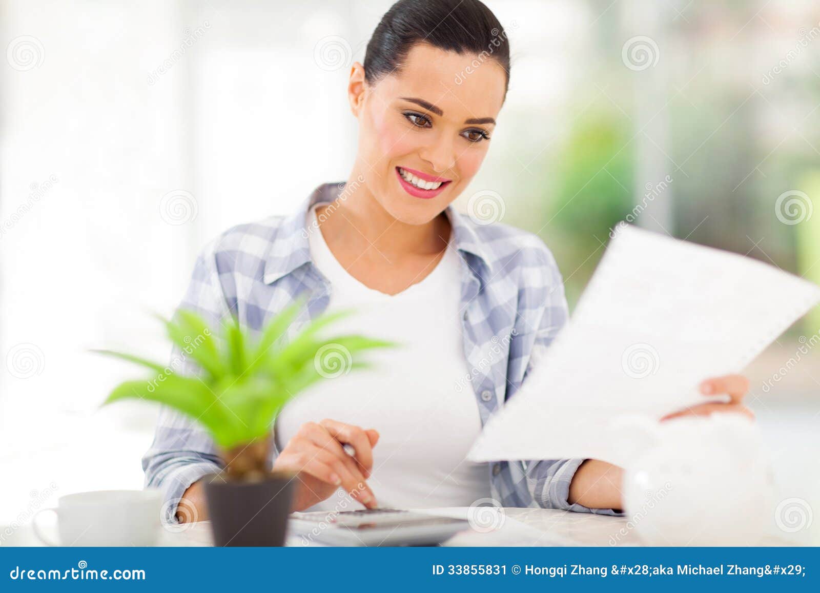Woman paying bills stock image. Image of casual, documents - 33855831
