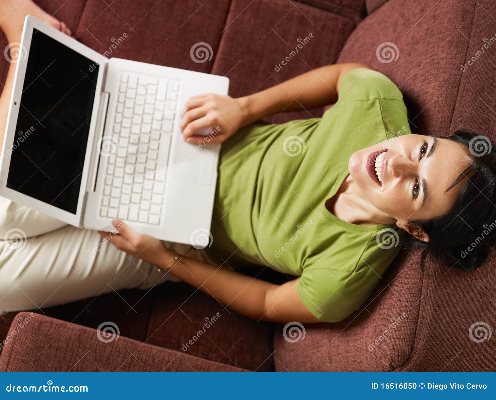Woman with Pc Laughing on Sofa Stock Photo - Image of high, clothing ...