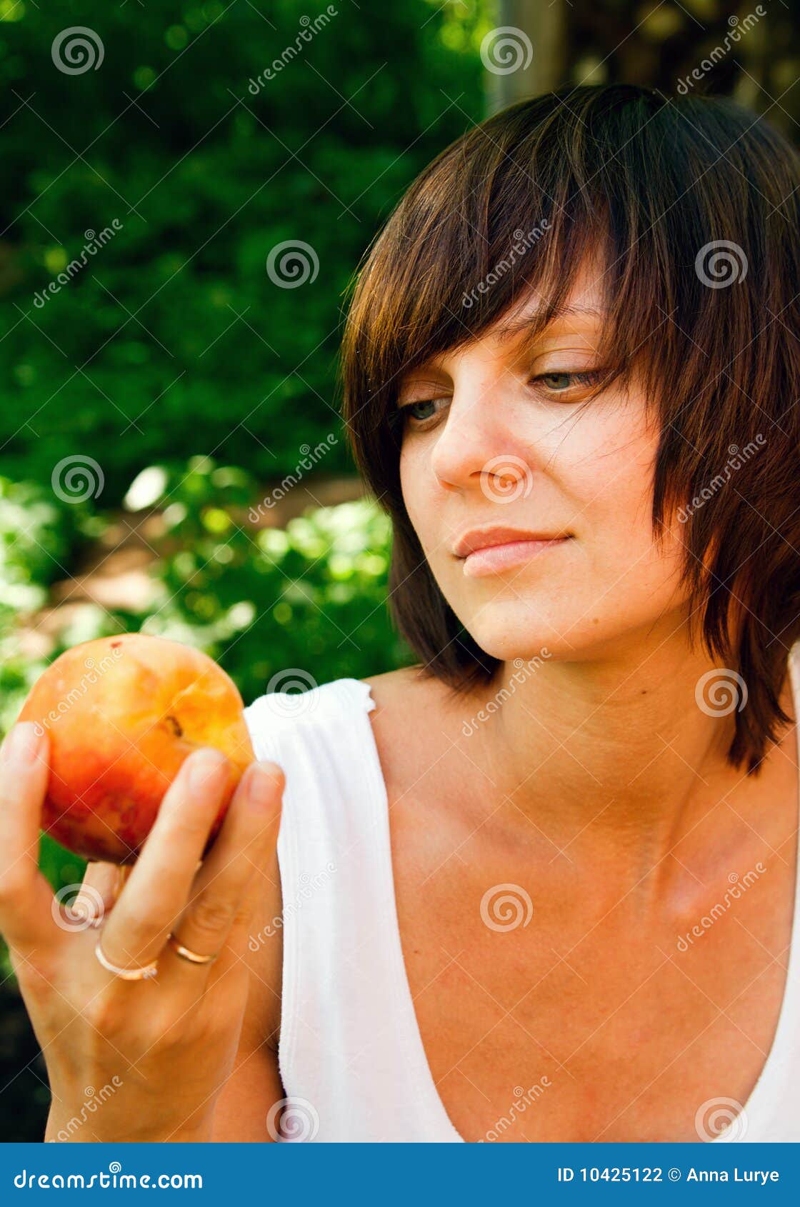 Woman And A Peach Picture. Image: 10425122
