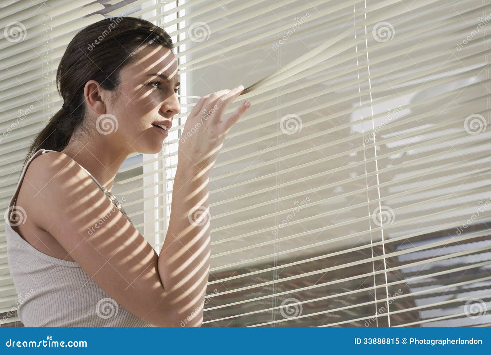Woman Peering through Blinds at Home Stock Image - Image of horizontal ...
