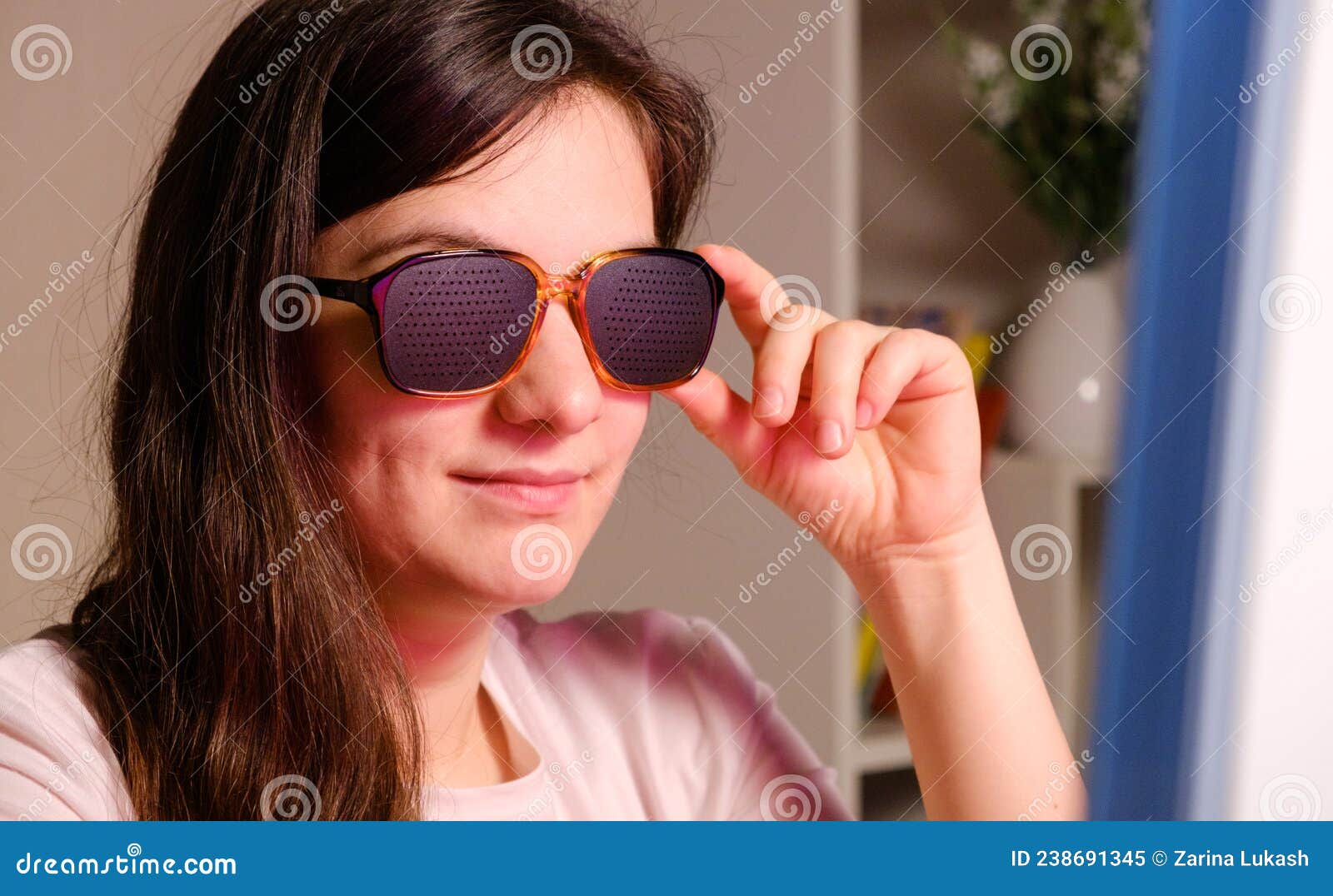 A Woman in Perforated Glasses Looks at the Computer Screen. Stock Image ...