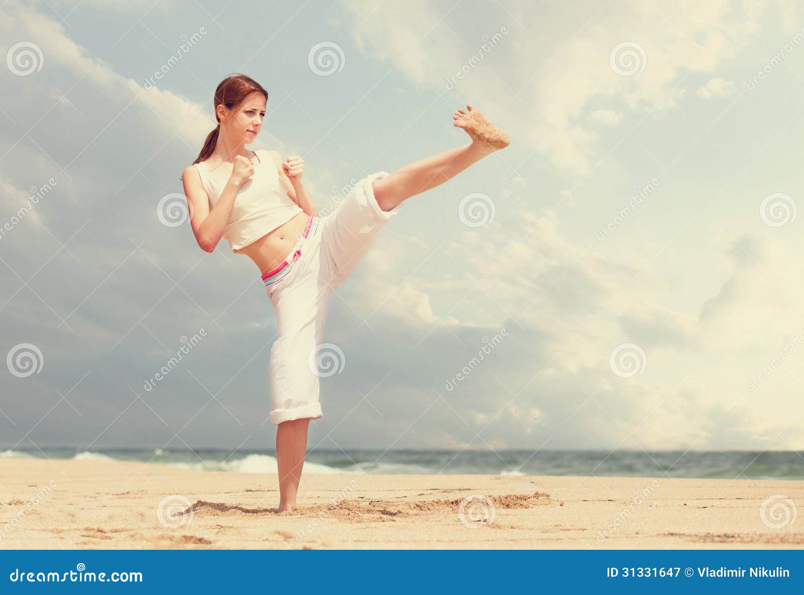 Woman performing a kick stock image. Image of kick, kickboxing - 31331647
