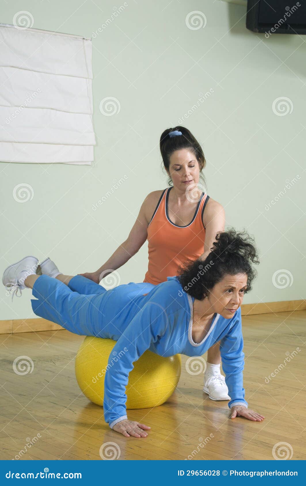 Woman with Personal Trainer Stock Photo - Image of wellness, adult ...