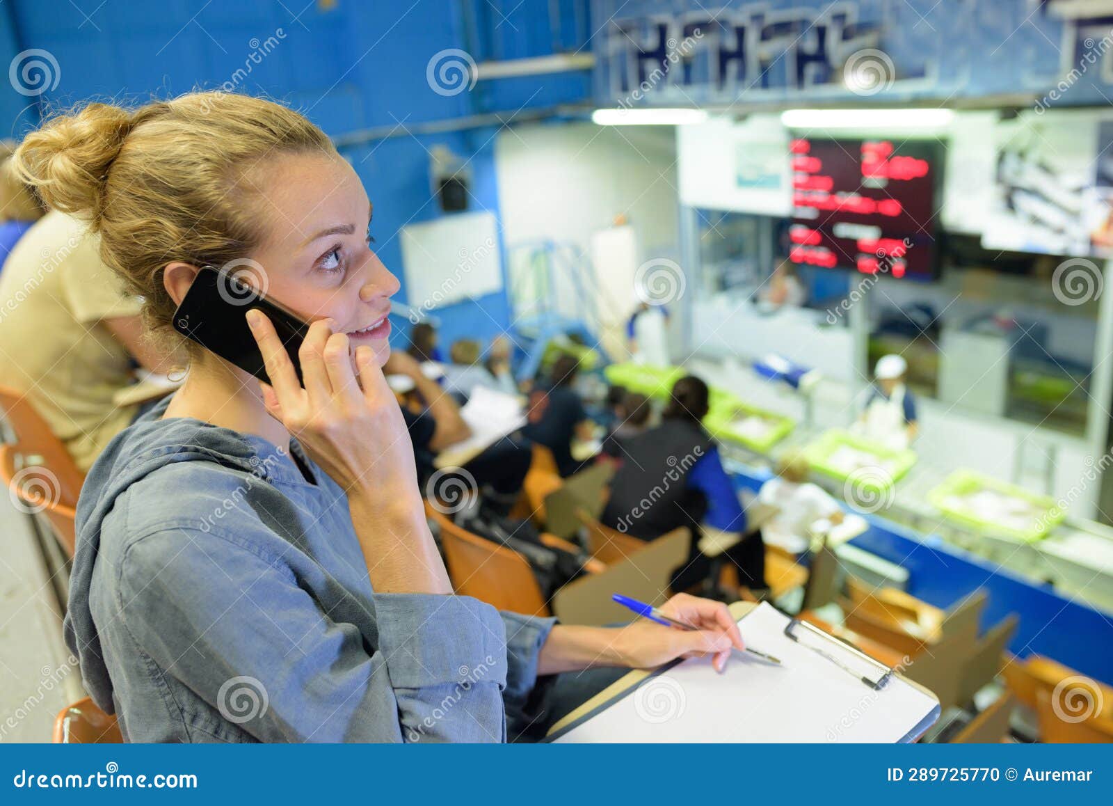 Woman on Phone on Fish Auction Stock Photo - Image of background ...