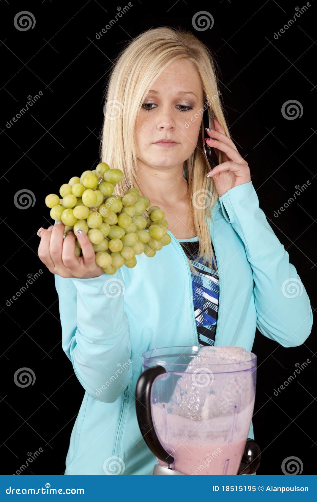 Woman on phone with grapes stock image. Image of female - 18515195