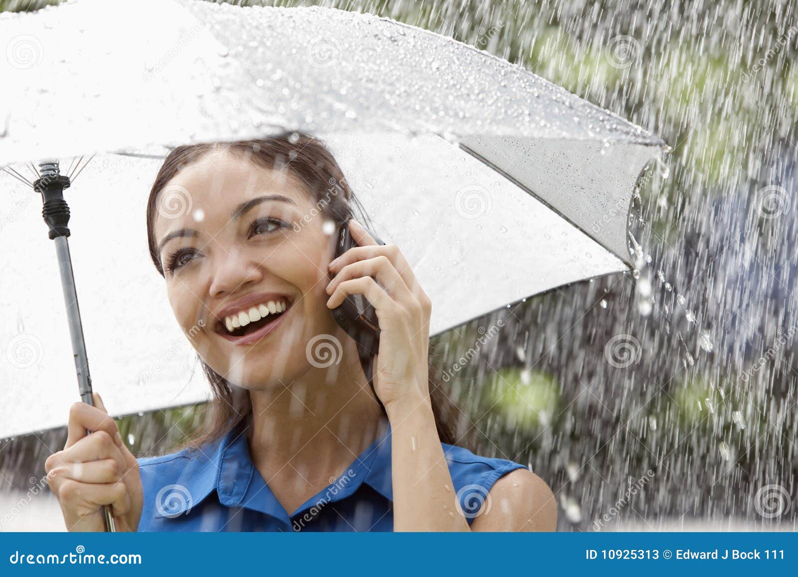 Woman on the Phone in the Rain Stock Image - Image of carrying, female ...