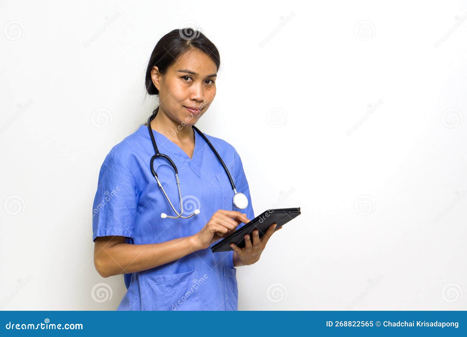 Woman Physical Therapist in Blue Uniform and Stethoscope Typing on ...