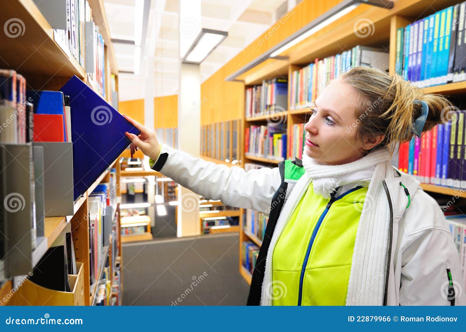 Woman picking a book stock photo. Image of indoor, knowledge - 22879966