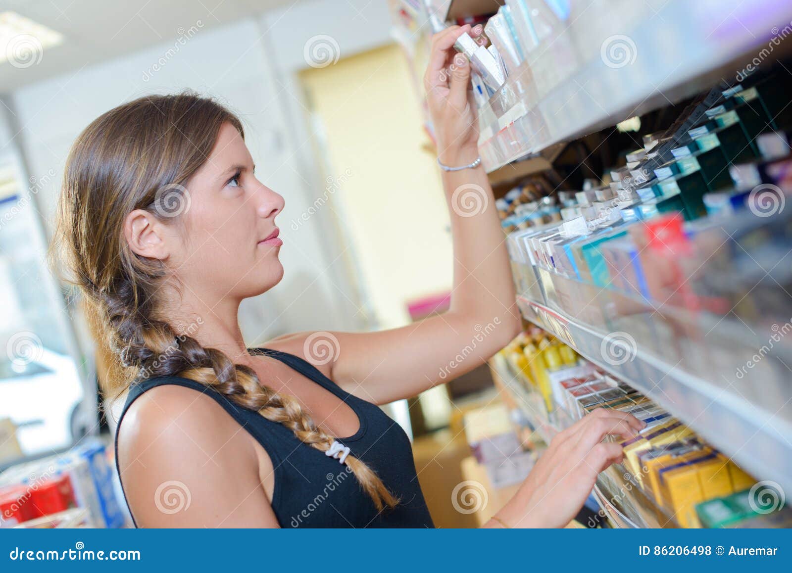 Woman Picking Product from Shelf Stock Photo - Image of choice ...