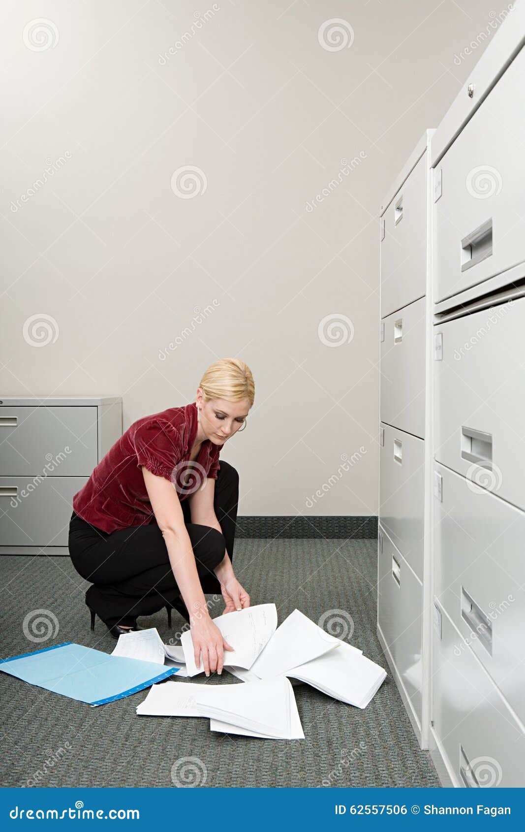 Woman Picking Up Dropped Paper Stock Photo - Image of business, beauty ...