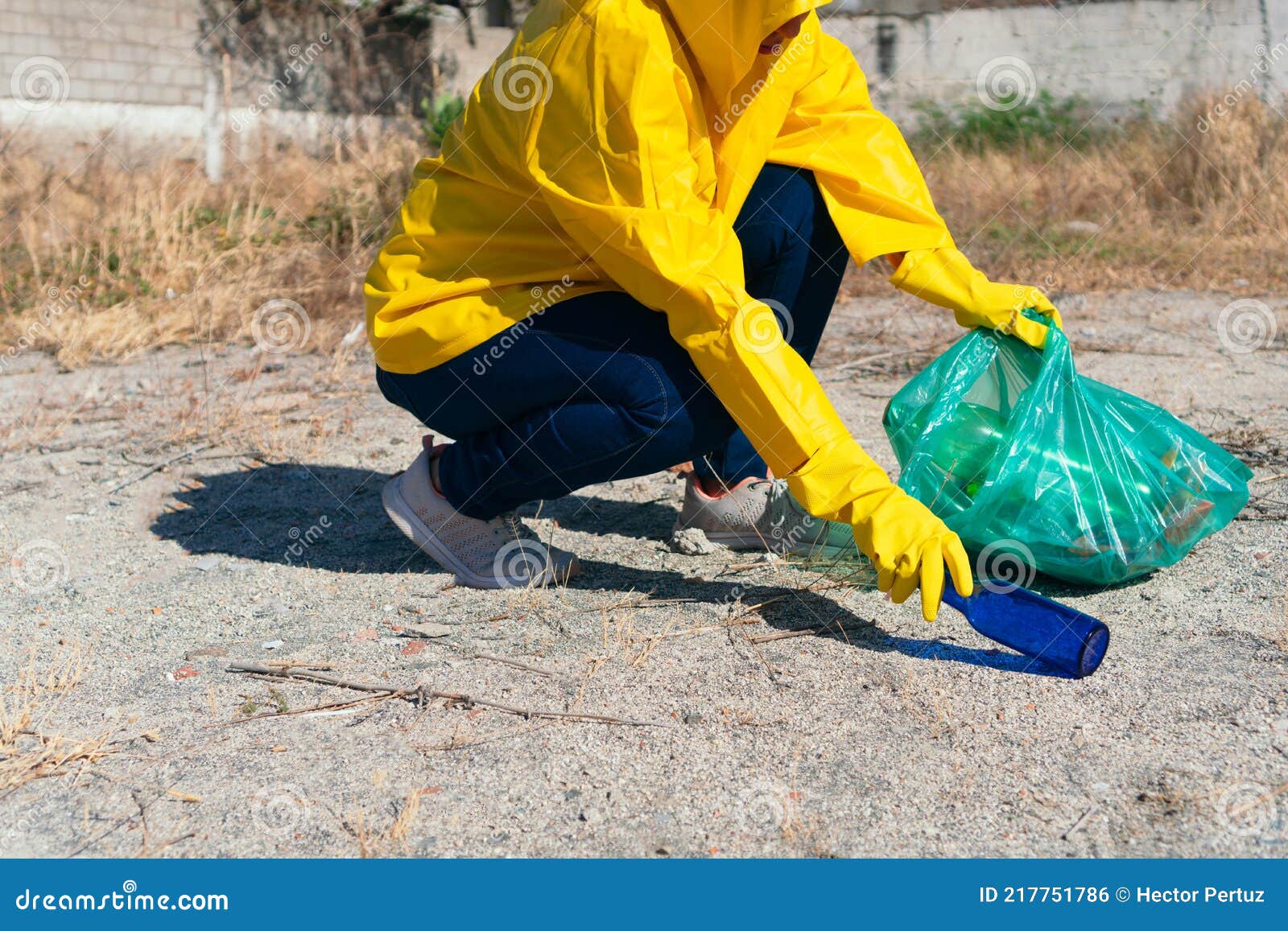 Woman Picking Up Plastic Garbage To Clean Up the Park Stock Photo ...