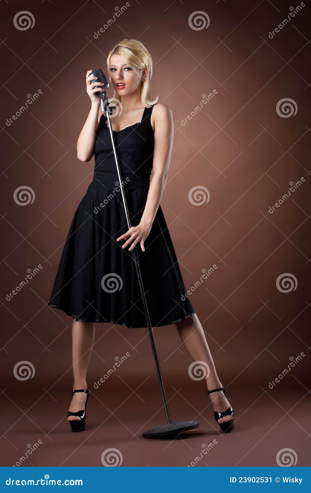 Woman Pin-up Portrait in Black with Microphone Stock Image - Image of ...