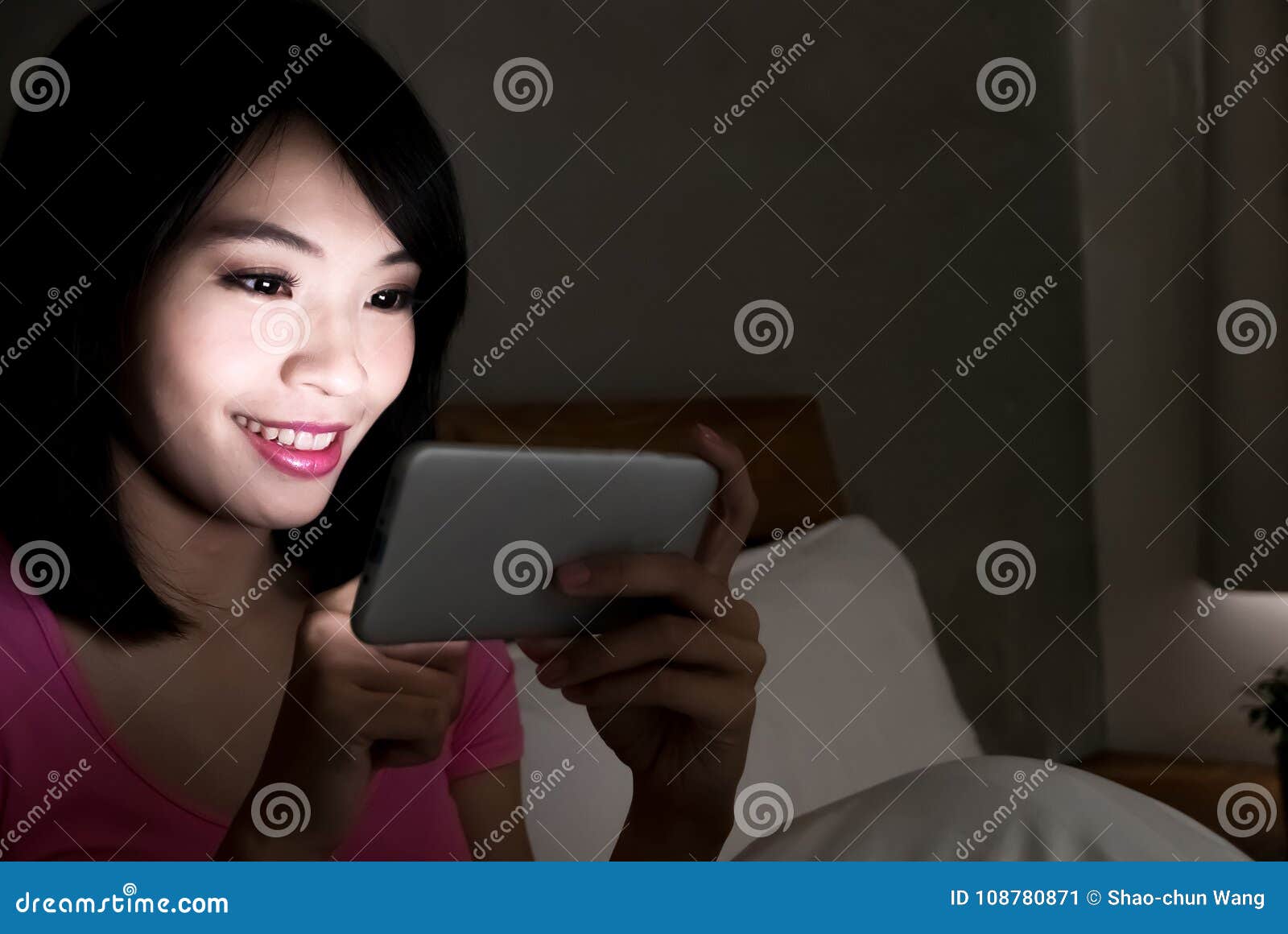 Woman play mobile game stock image. Image of bedroom - 108780871