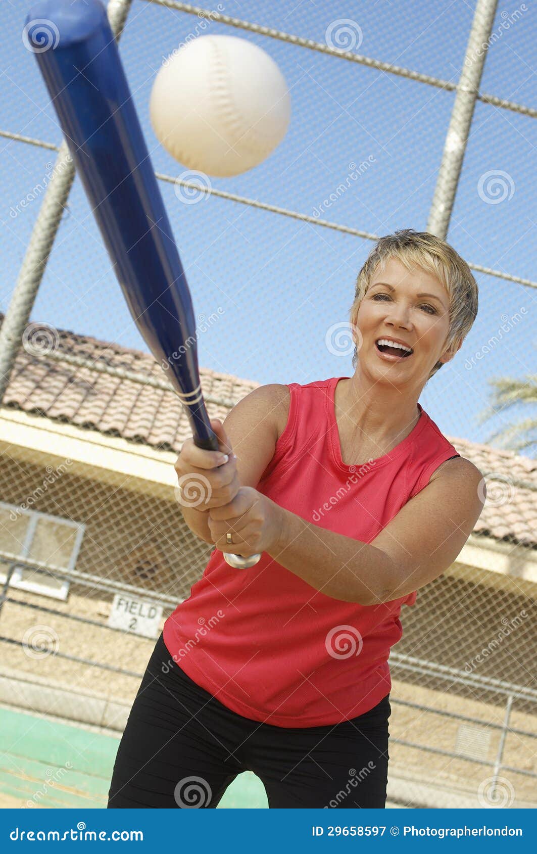 Woman Playing Baseball stock image. Image of active, fence - 29658597