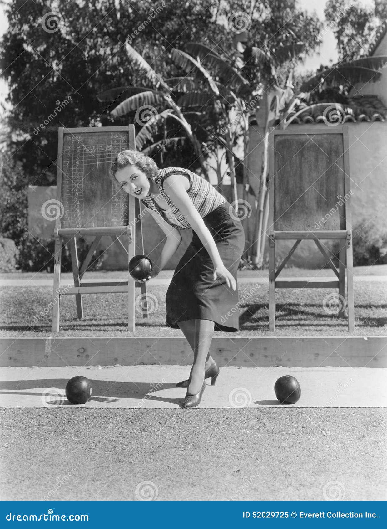 Woman Playing Bocce Outdoors Stock Image - Image of cheery, chair: 52029725