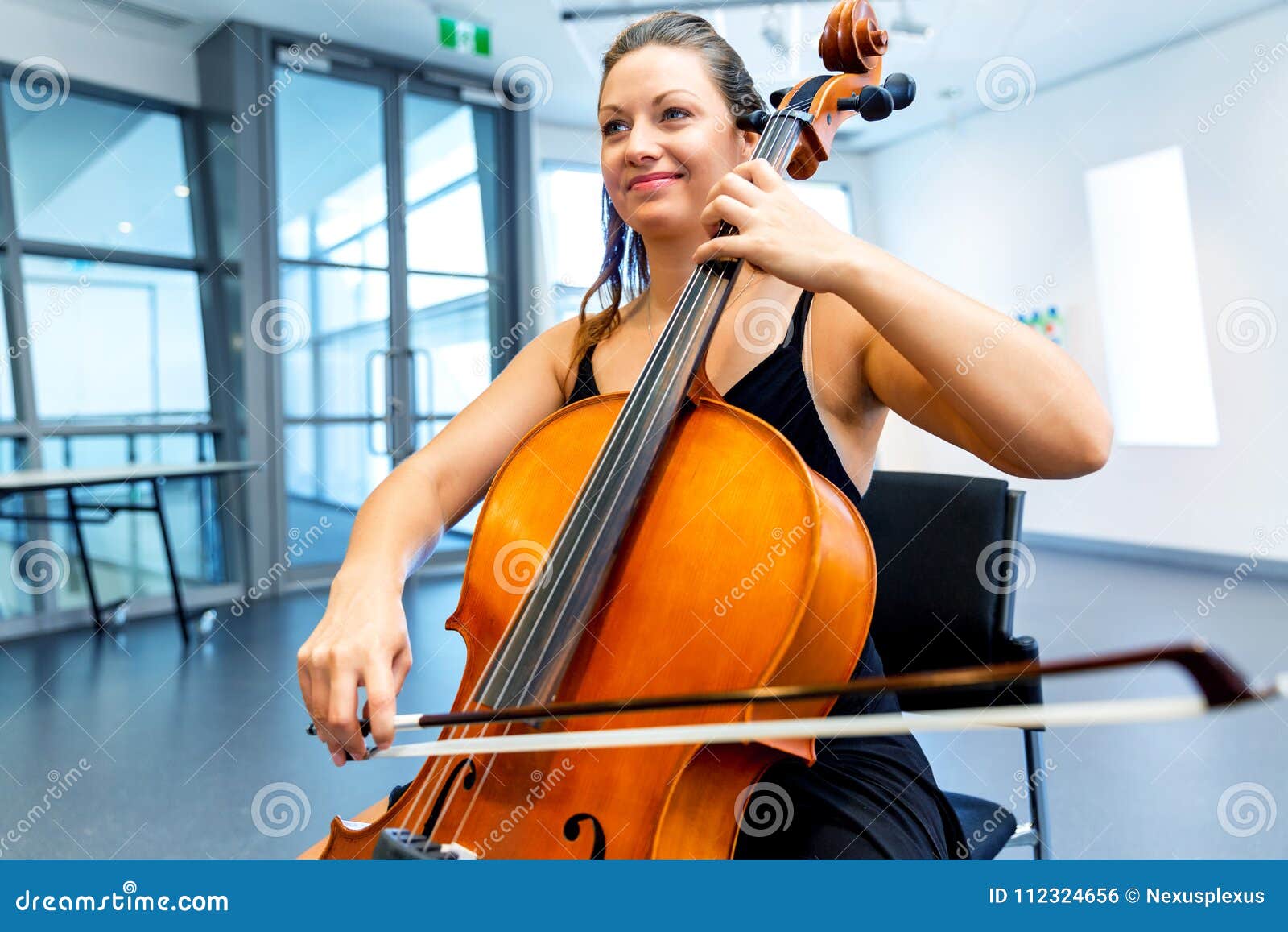 Woman playing cello stock photo. Image of performer - 112324656