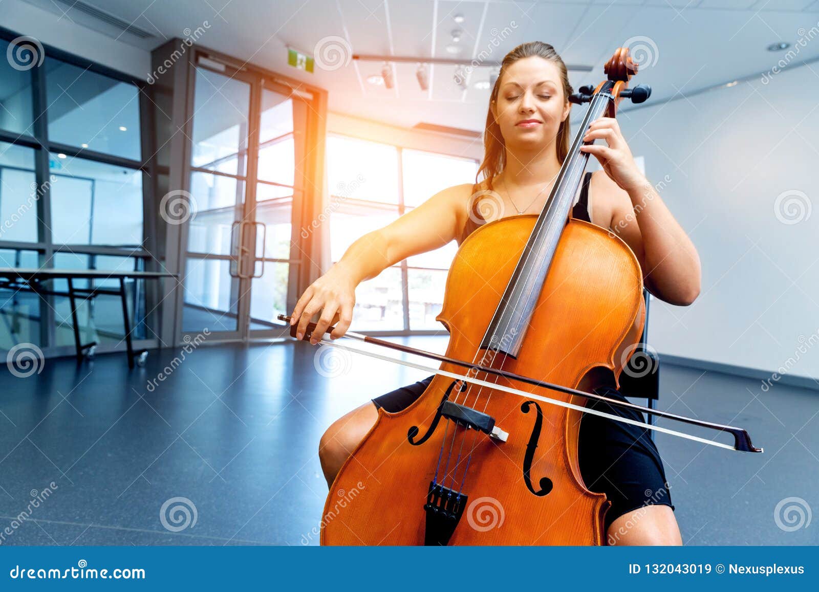 Woman playing cello stock image. Image of classic, instrument - 132043019