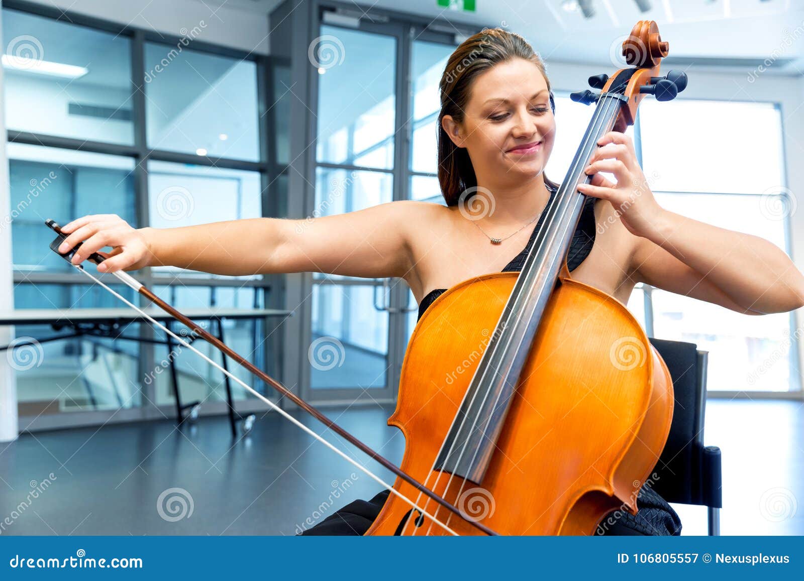 Woman playing cello stock image. Image of adult, beautiful - 106805557