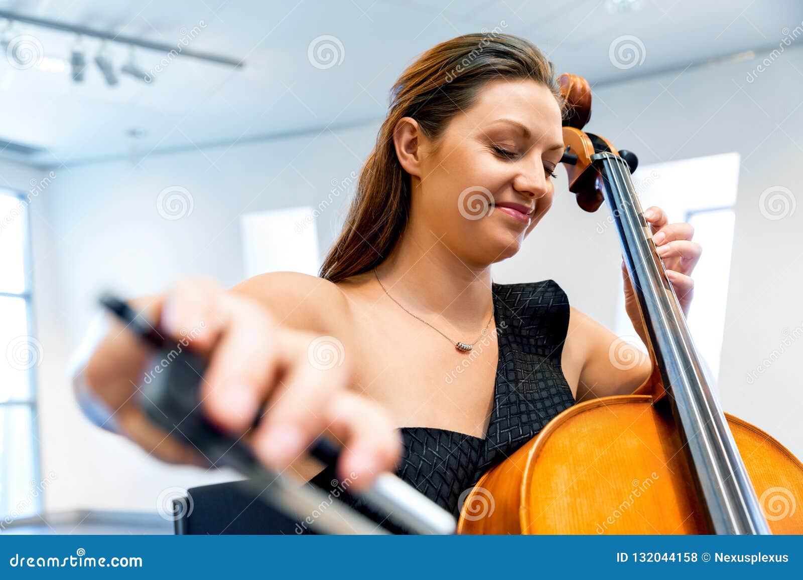 Woman playing cello stock photo. Image of professional - 132044158