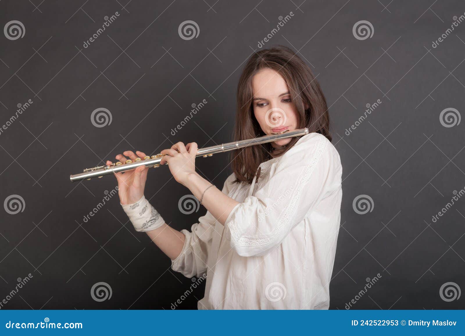 Woman playing the flute stock image. Image of performance - 242522953