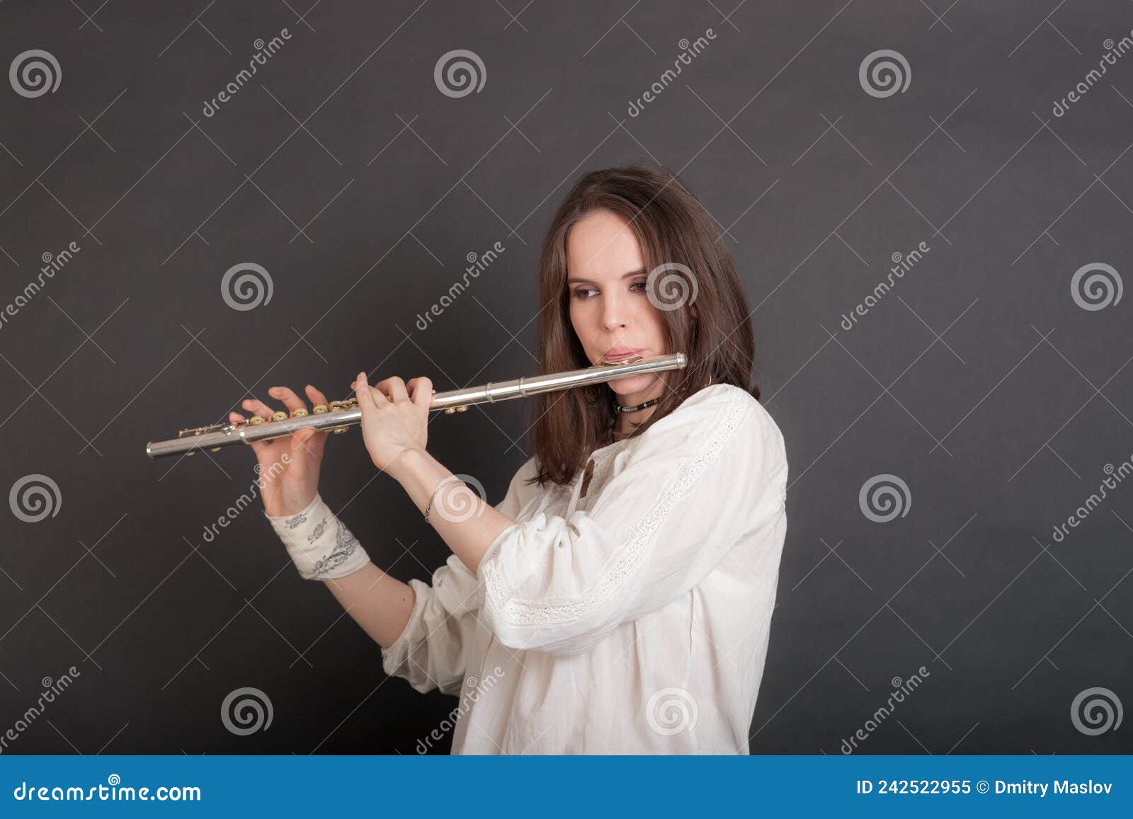 Woman playing the flute stock image. Image of performance - 242522955