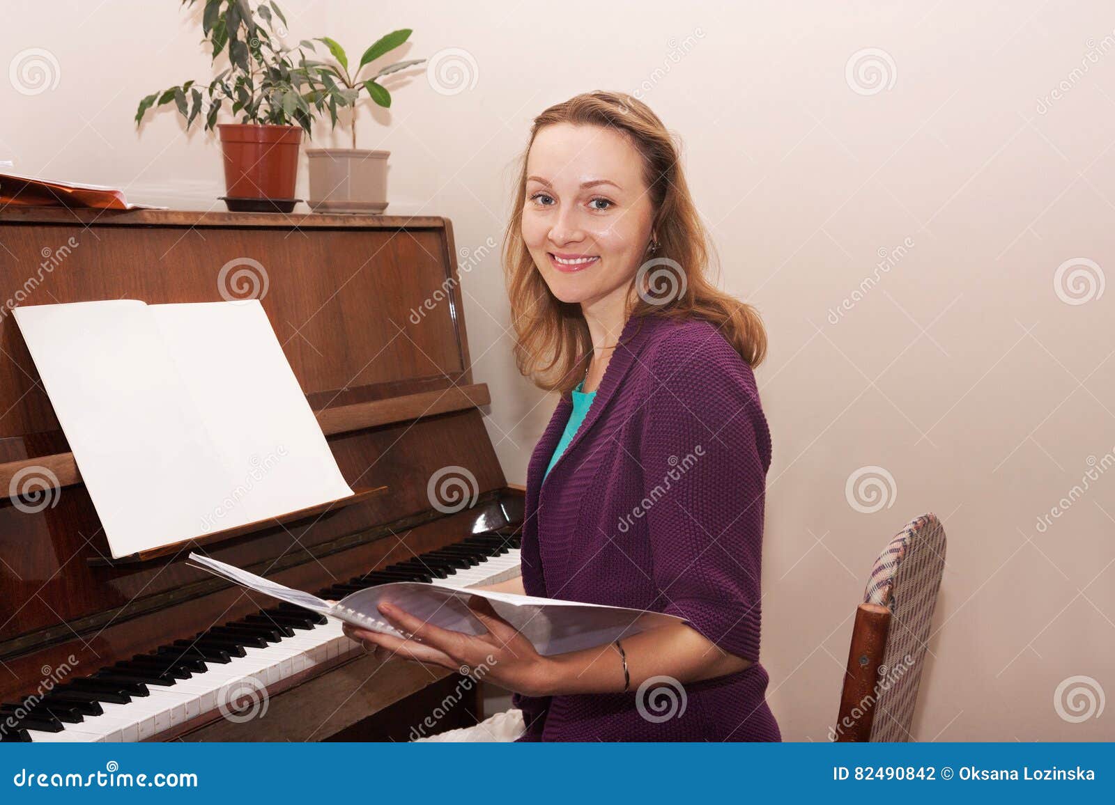 Woman playing the piano stock photo. Image of piano, instrument - 82490842