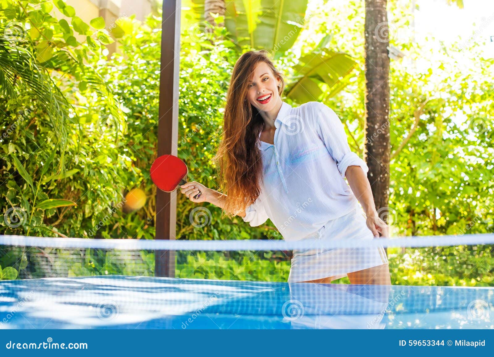 Woman playing ping pong stock photo. Image of exotic - 59653344