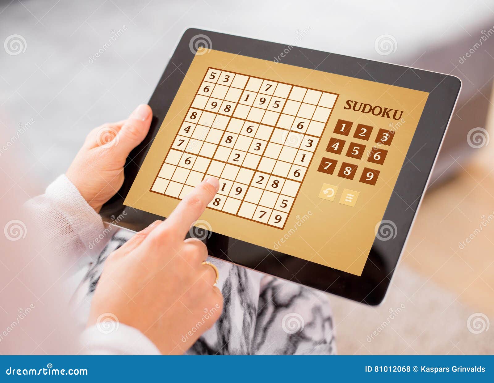 Woman Playing Sudoku on Tablet Computer Stock Photo - Image of ...