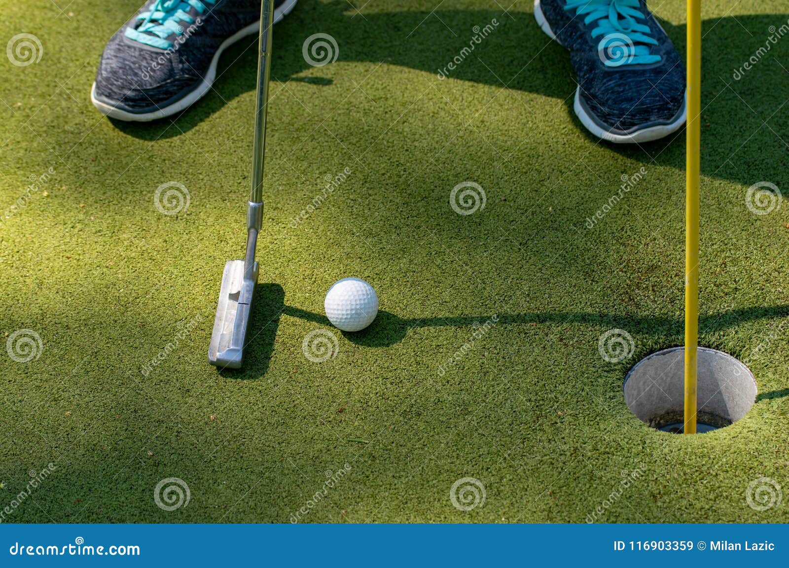 Woman plays miniature golf stock image. Image of clubs - 116903359
